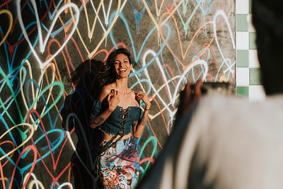 Beautiful model posing by a wall | Premium Photo - rawpixel
