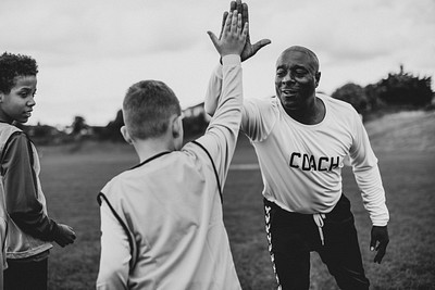Football coach doing high five | Free Photo - rawpixel