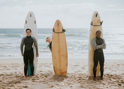 Happy friends surfing at the beach | Premium Photo - rawpixel