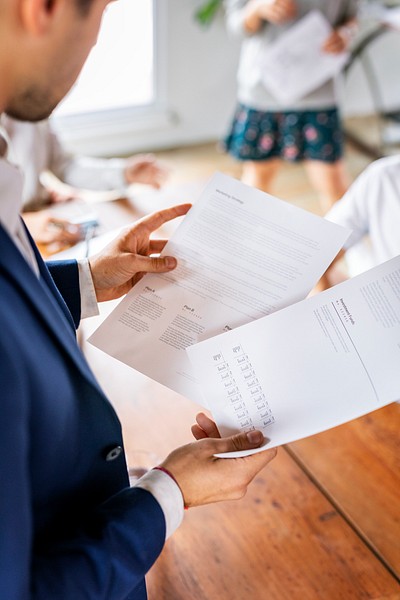 Businessman reading document meeting | Premium Photo - rawpixel