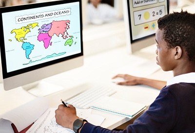 Student learning geography online in a classroom | Free Photo - rawpixel