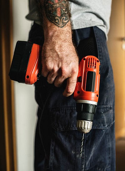 Constractor handyman working using screwdriver | Premium Photo - rawpixel
