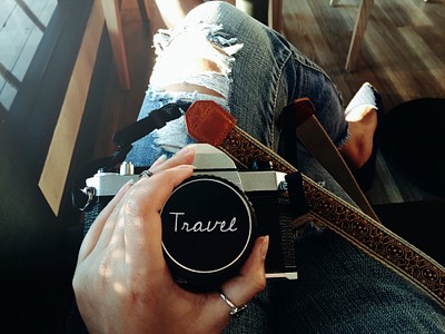 Woman Sitting Camera Waiting Travel | Free Photo - rawpixel
