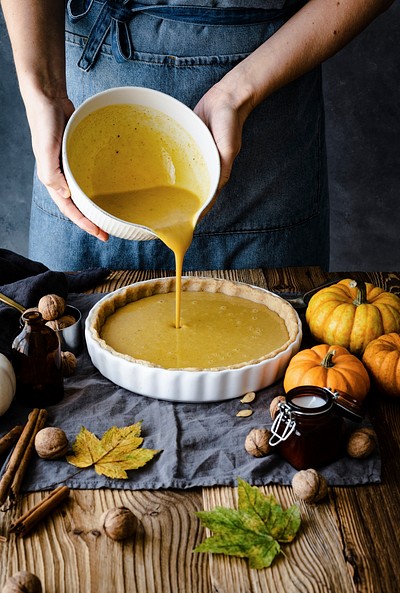 Baker pouring pumpkin puree plate | Premium Photo - rawpixel