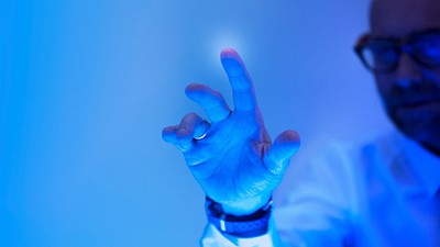 Man touching futuristic blue screen | Premium Photo - rawpixel