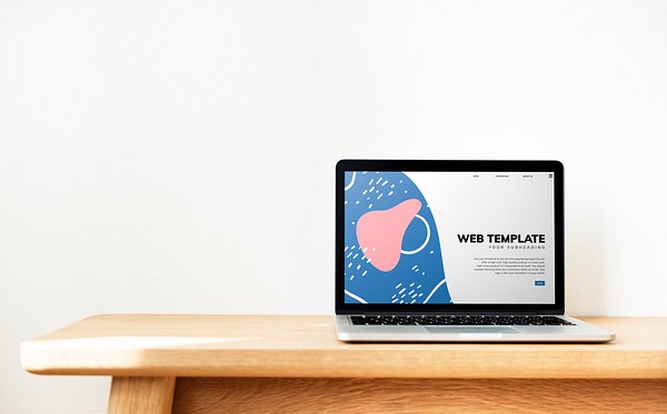 Laptop showing website template wooden | Premium PSD Mockup - rawpixel