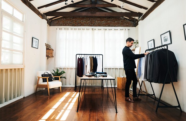 stylish is choosing cloth rack | Premium Photo - rawpixel