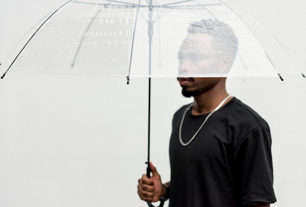 African man using an umbrella | Premium Photo - rawpixel