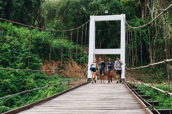 Group of friends walking on the bridge | Premium Photo - rawpixel