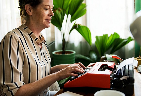 Woman typing retro typewriter | Premium Photo - rawpixel