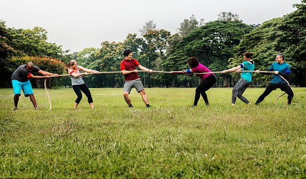 Team competing tug war | Premium Photo - rawpixel