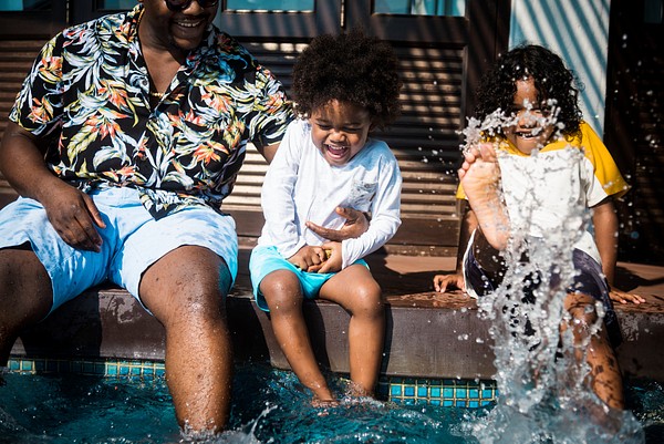 Family playing in a pool | Premium Photo - rawpixel