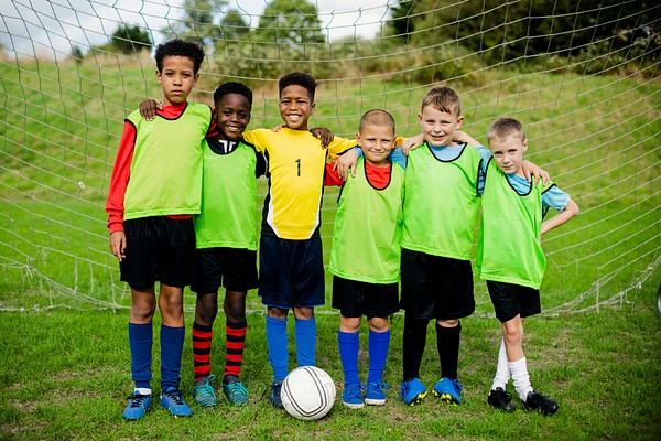 Junior football team standing together | Free Photo - rawpixel