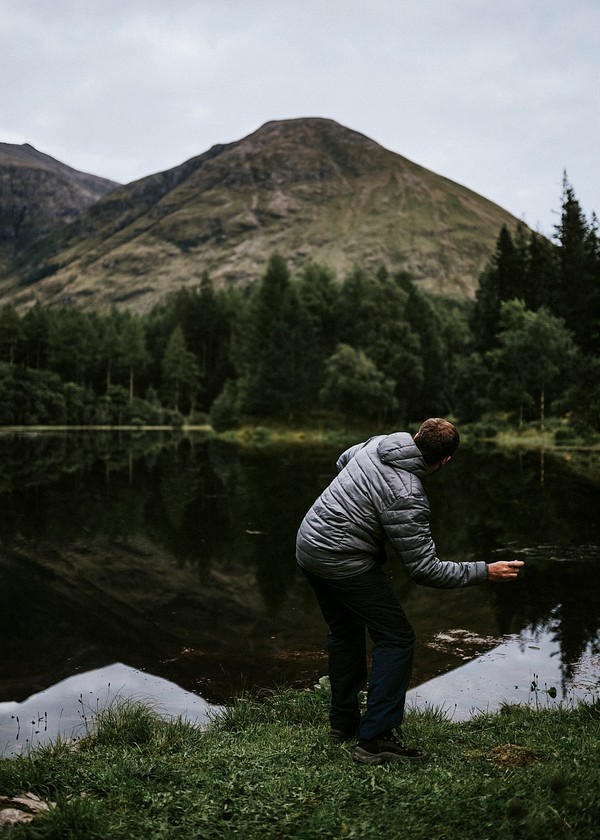 Man throwing stone water | Premium Photo - rawpixel