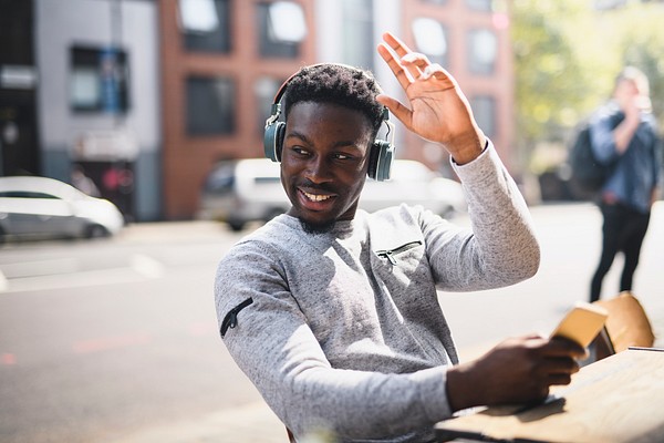 Man greeting friend cafe | Premium Photo - rawpixel