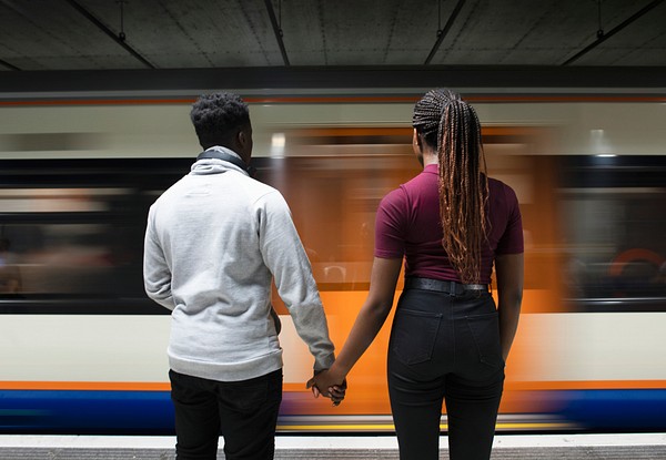 Couple holding hands as train | Premium Photo - rawpixel