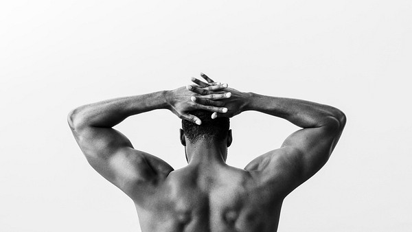 Black man stretching his back | Premium Photo - rawpixel