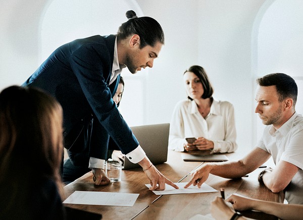 Businessman reading document meeting | Premium Photo - rawpixel