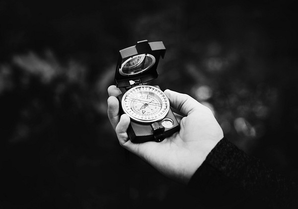 Man checking a compass for direction | Premium Photo - rawpixel