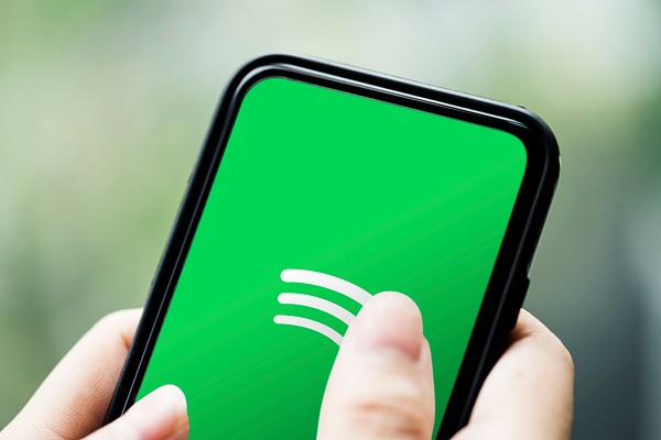 Woman using Spotify mobile phone. | Free Photo - rawpixel