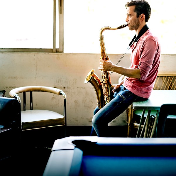 A musician with his saxophone | Premium Photo - rawpixel