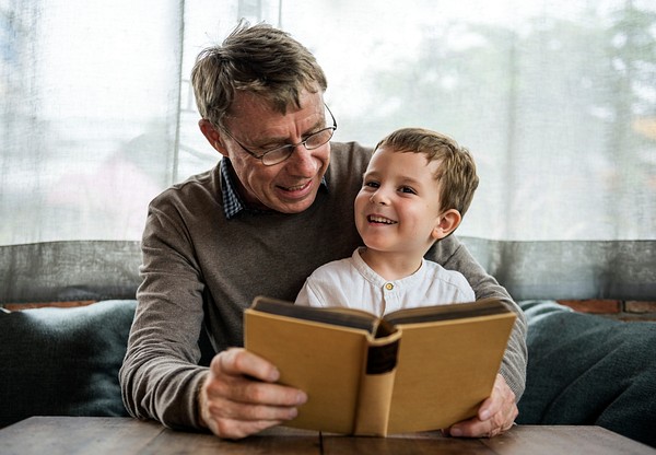 Grandfather and grandson reading book | Premium Photo - rawpixel