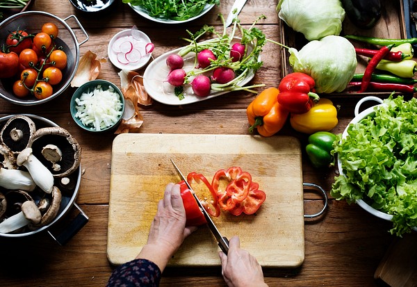 A person slicing vegetables | Premium Photo - rawpixel