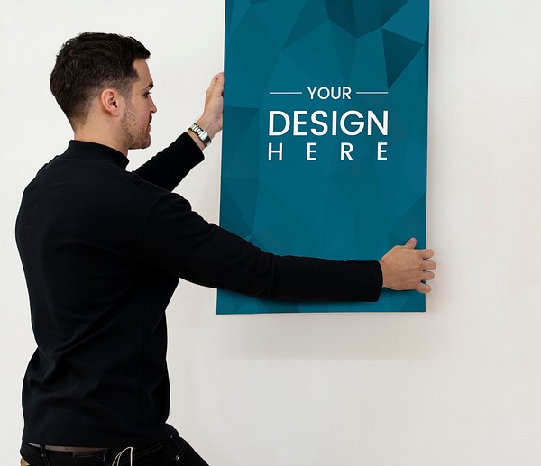 Man hanging poster mockup wall | Premium PSD Mockup - rawpixel