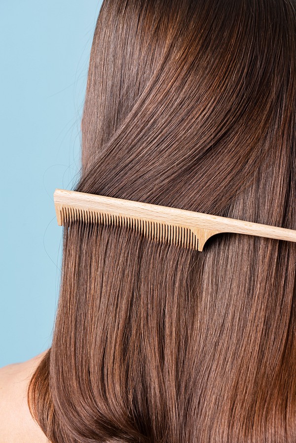 Woman combing her sleek hair | Premium Photo - rawpixel