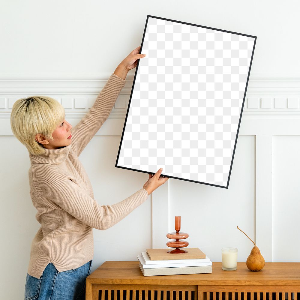Woman hanging a photo frame | Free PNG - rawpixel