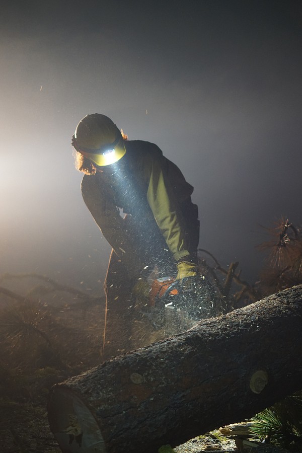 Firefighter cutting log. Original public | Free PNG - rawpixel