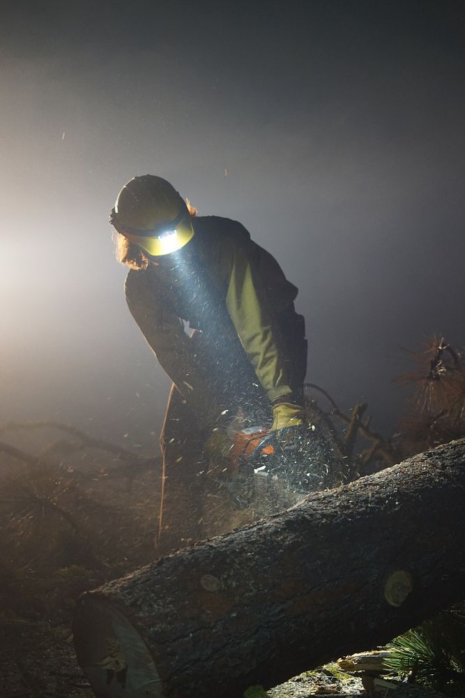 Firefighter cutting log. Original public | Free PNG - rawpixel