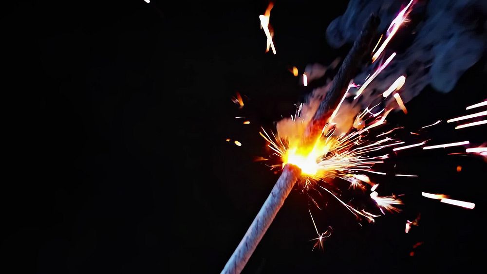 Close-up, angled shot sparkler igniting | Free Video - rawpixel