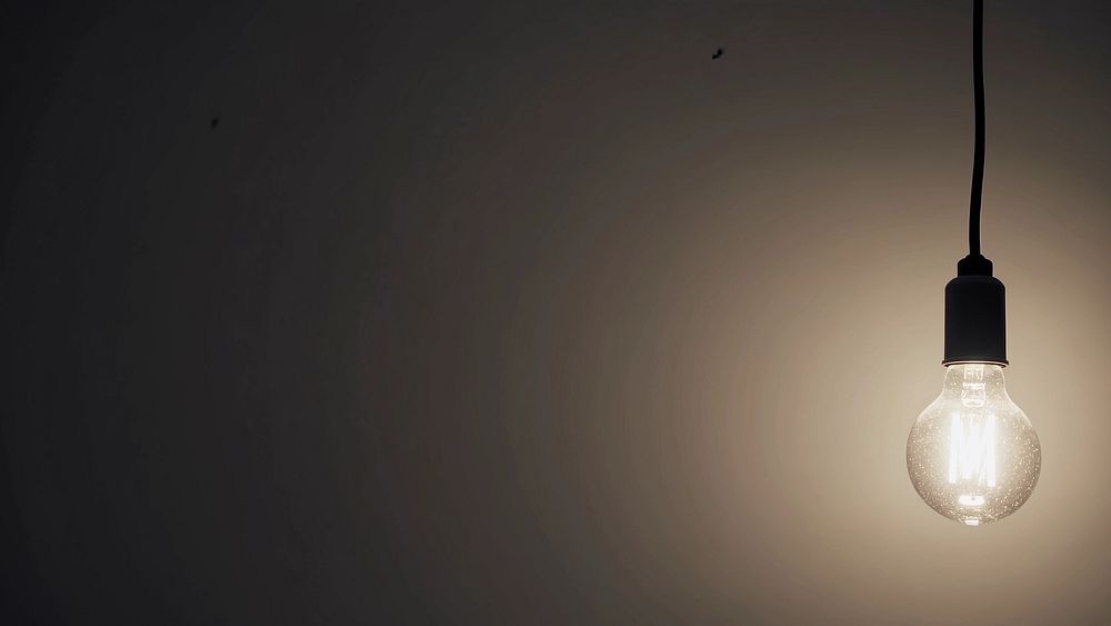 dimly lit light bulb hangs | Free Video - rawpixel