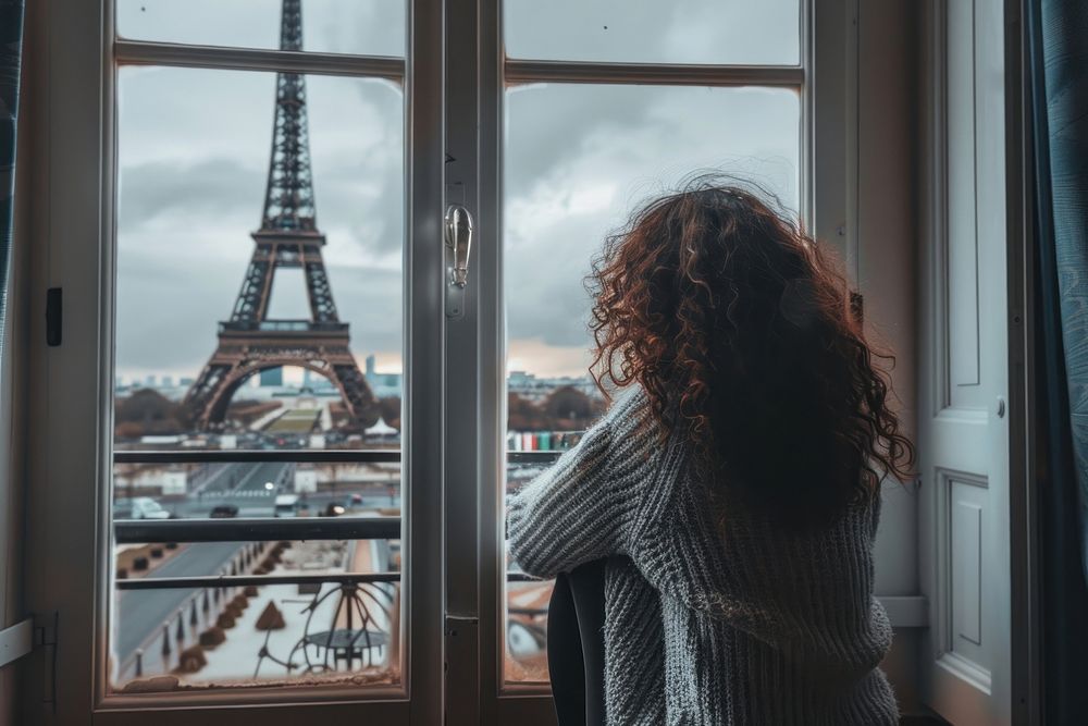 Woman sitting front window tower | Free Photo - rawpixel