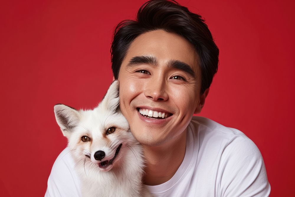 Hispanic man holding fox wildlife | Free Photo - rawpixel