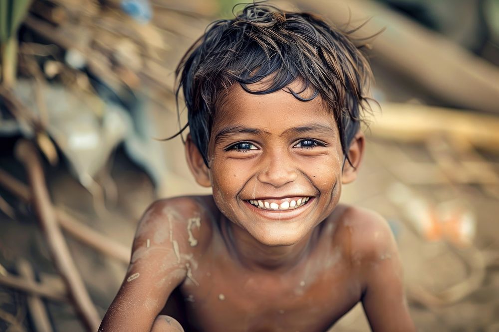 Poor child smiling happily an | Free Photo - rawpixel