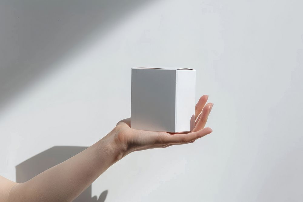 Hand white win box cardboard | Free Photo - rawpixel