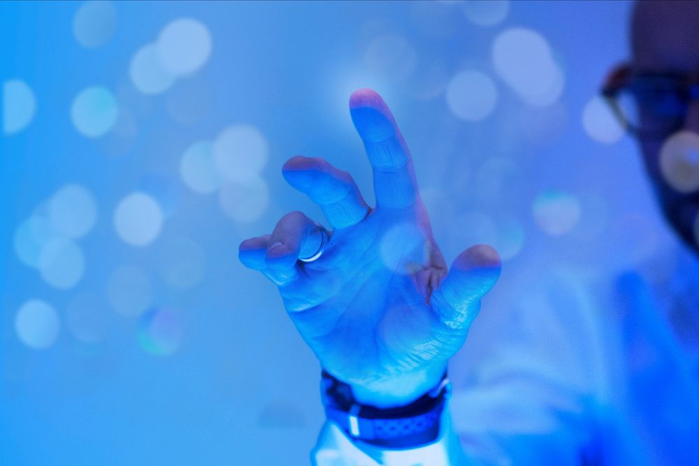 Man touching futuristic blue screen | Free Photo Illustration - rawpixel