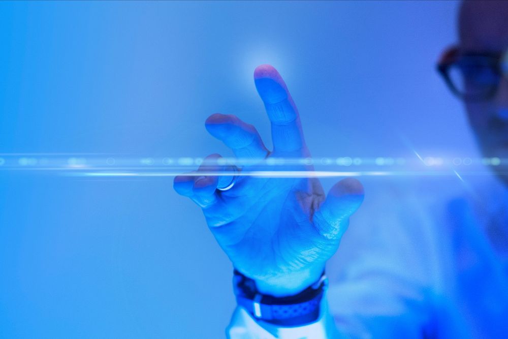 Man touching futuristic blue screen | Free Photo Illustration - rawpixel