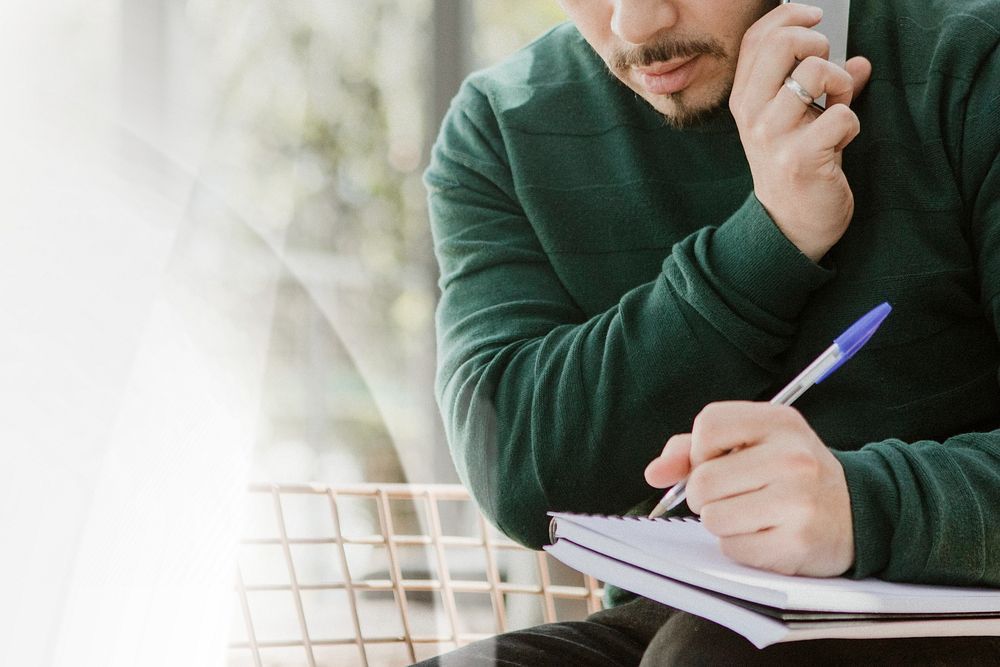 Man taking notes while talking | Free Photo Illustration - rawpixel