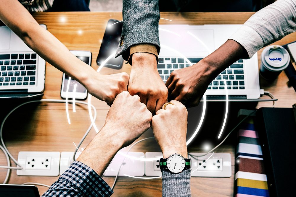 Colleagues giving a fist bump | Free Photo Illustration - rawpixel