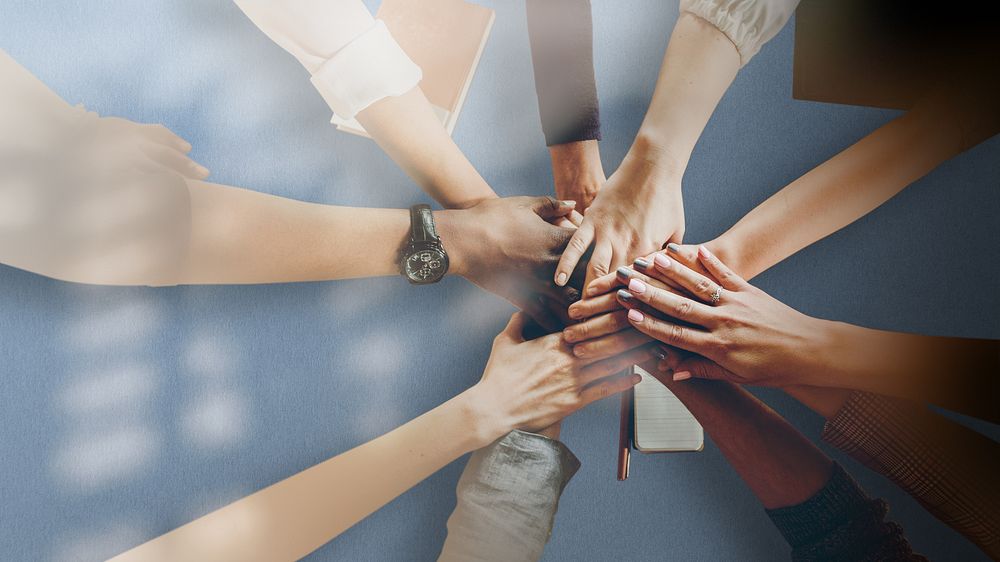 Diverse people stacking hands together | Free Photo Illustration - rawpixel
