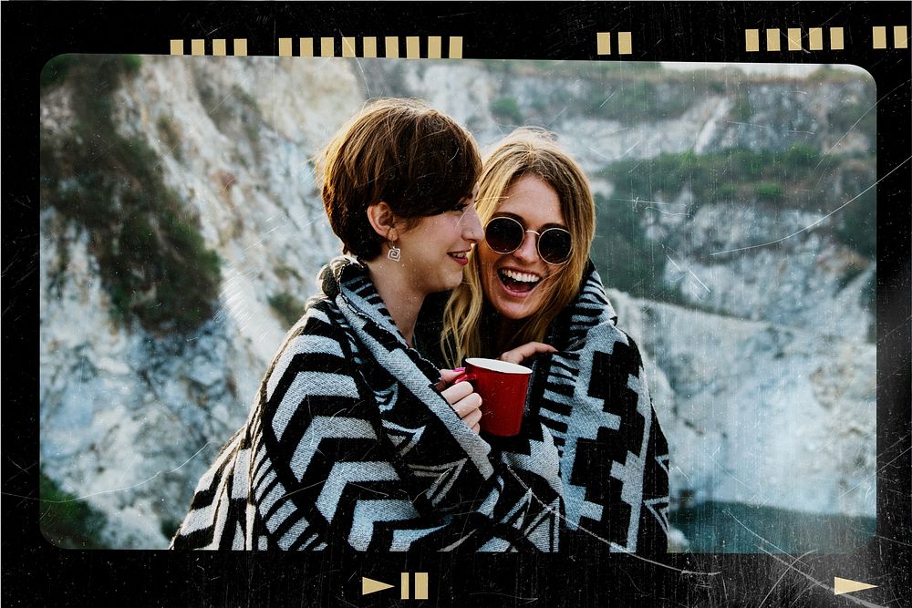 Girlfriends cuddle together blanket top | Free Photo Illustration ...