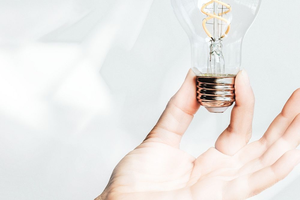 Hand holding a light bulb | Free Photo Illustration - rawpixel