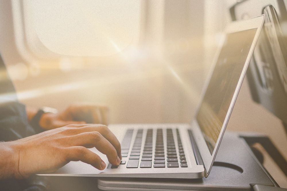 Man using laptop plane | Free Photo - rawpixel