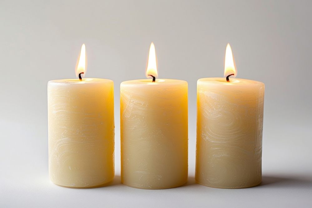 Three lit candles row | Free Photo - rawpixel