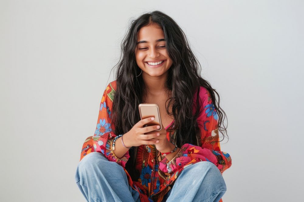 Happy woman using smartphone | Free Photo - rawpixel