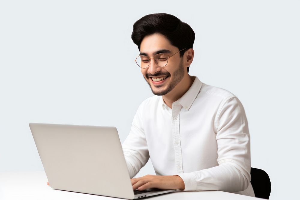 Man smiling using laptop | Free Photo - rawpixel