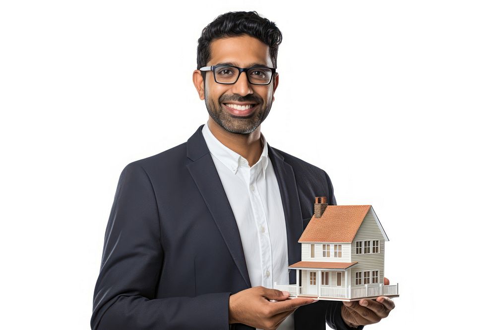 Smiling realtor holding model house | Free Photo - rawpixel